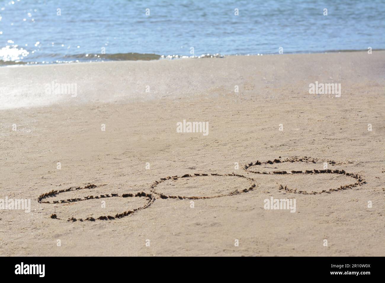 SOS message written on sand near sea Stock Photo - Alamy