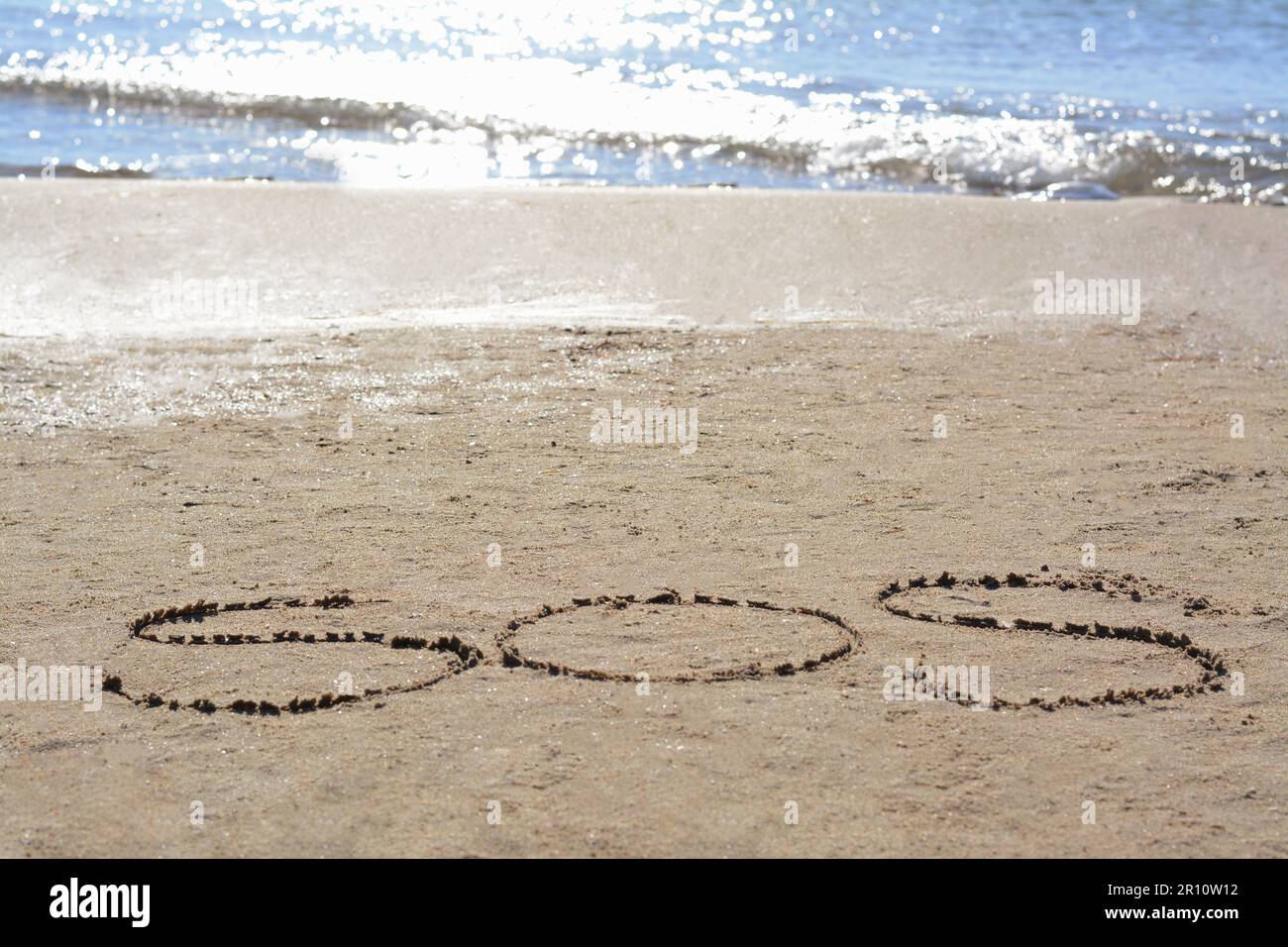 Sos message written on sand hi-res stock photography and images - Alamy