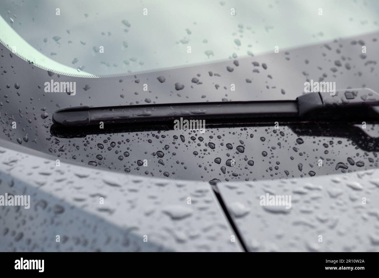 Car wiper and water drops on windshield glass, closeup Stock Photo - Alamy