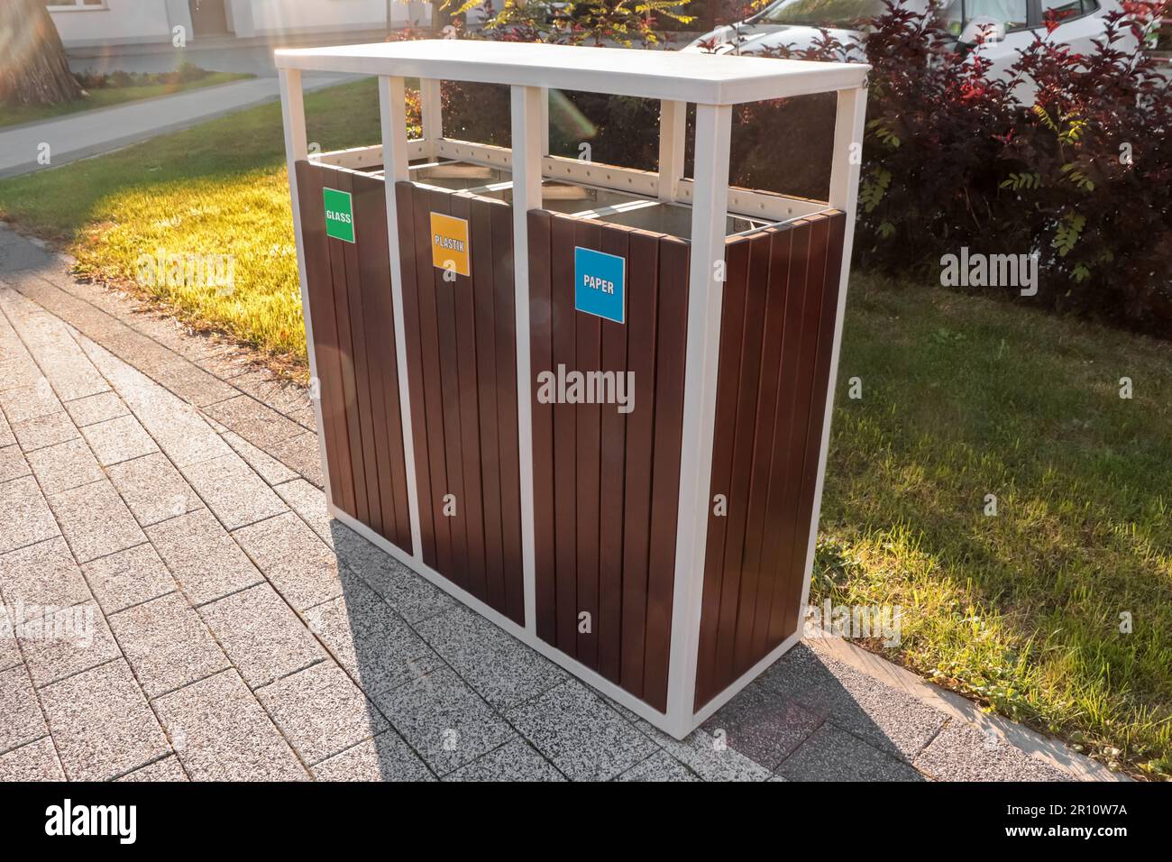 Different sorting bins for waste recycling on sunny day outdoors Stock ...