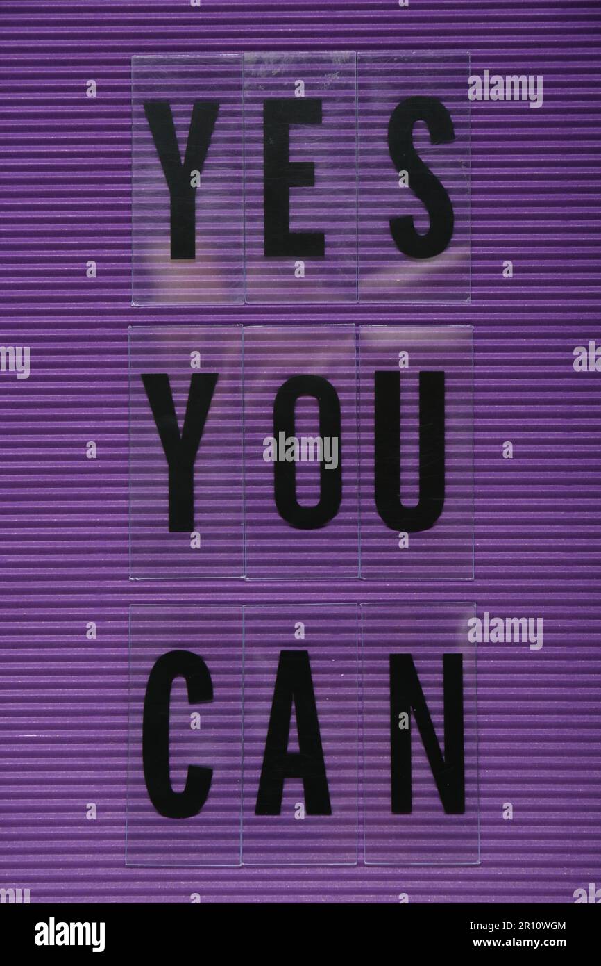 Phrase Yes You Can of plastic letters on purple background, top view ...