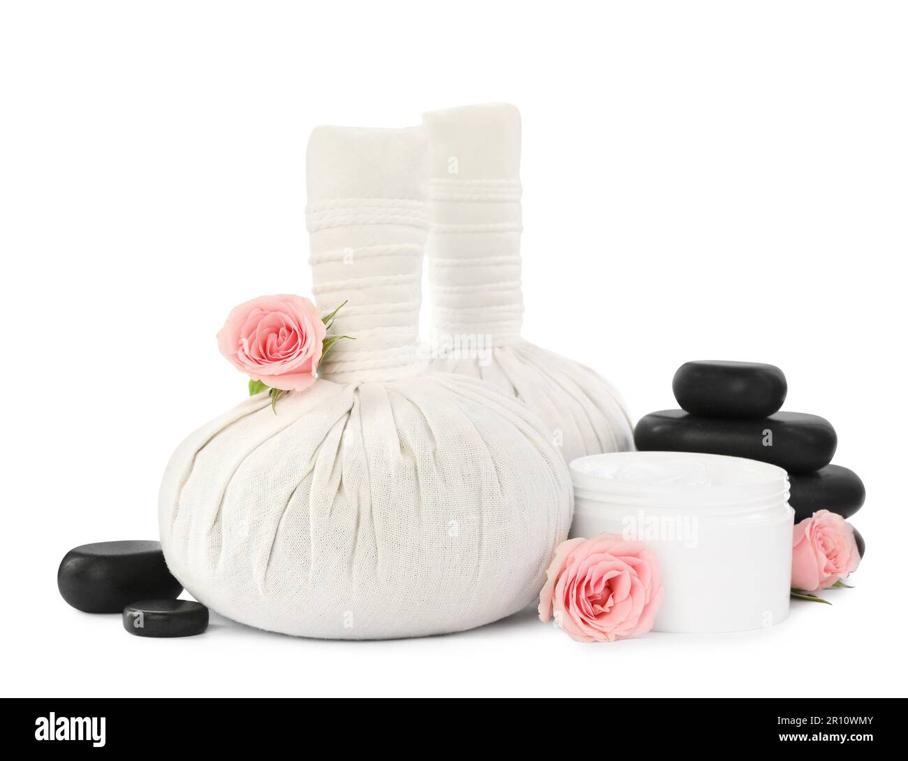 Herbal massage bags, spa stones, flowers and cream on white background ...