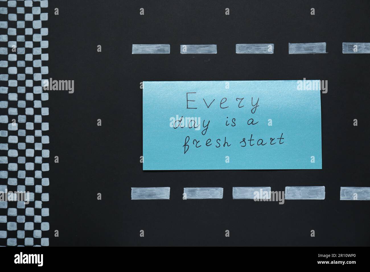 Card with phrase Every Day Is A Fresh Start on black background, top ...