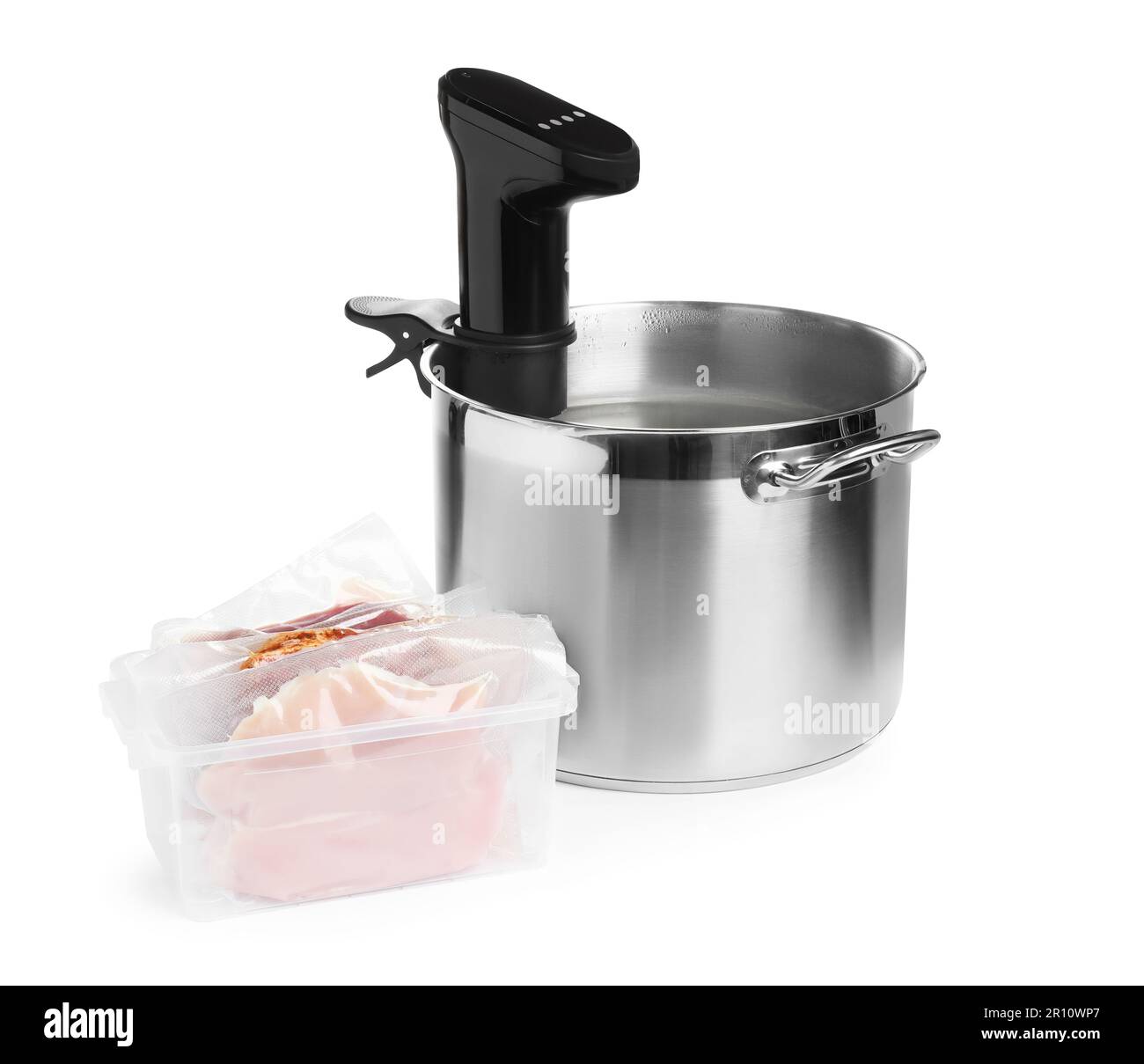 Thermal immersion circulator in pot and meat on white background ...