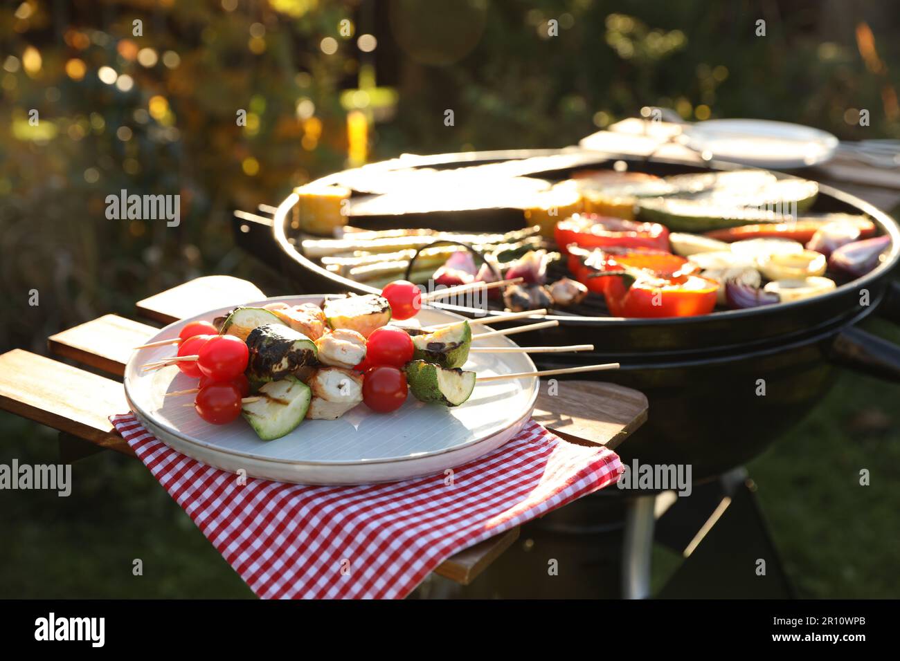 Cooked food products and grill barbecue outdoors Stock Photo - Alamy