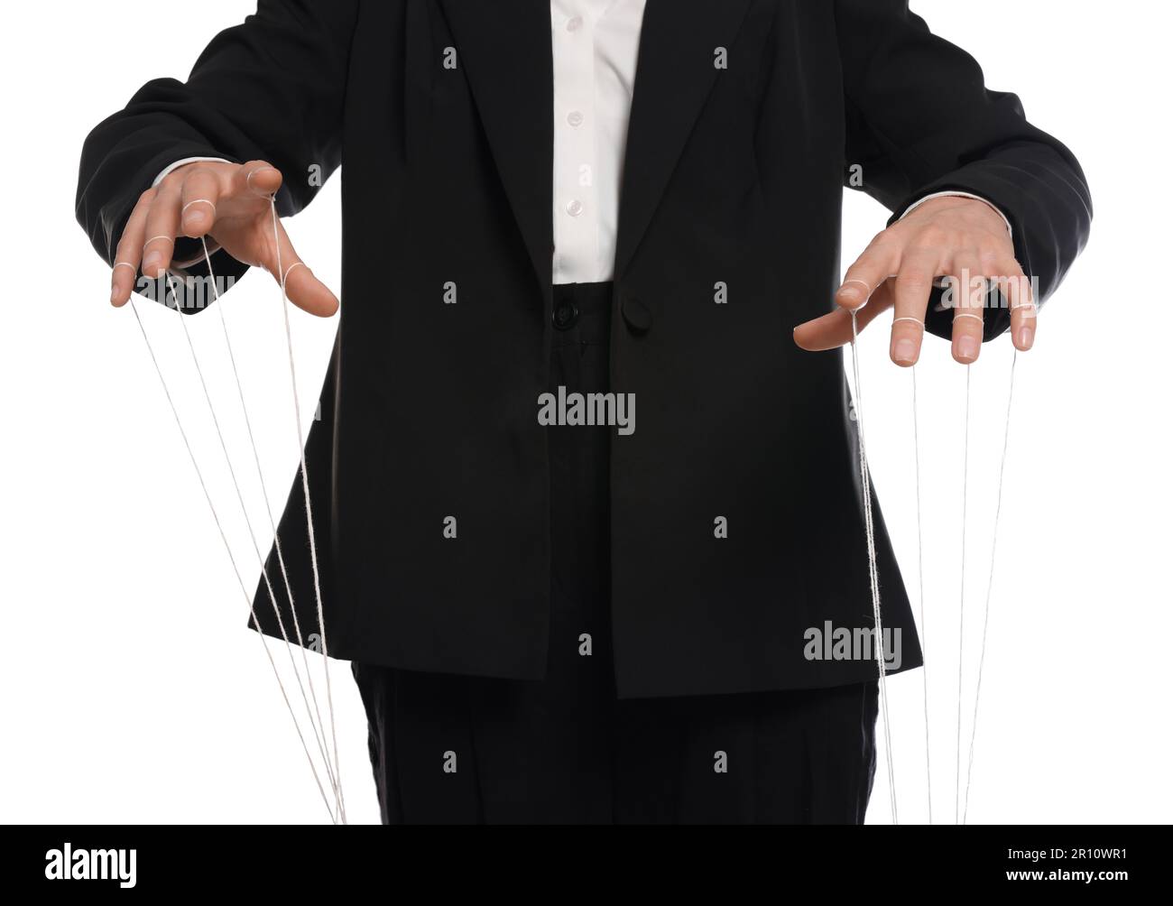 Woman in suit pulling strings of puppet on white background, closeup ...