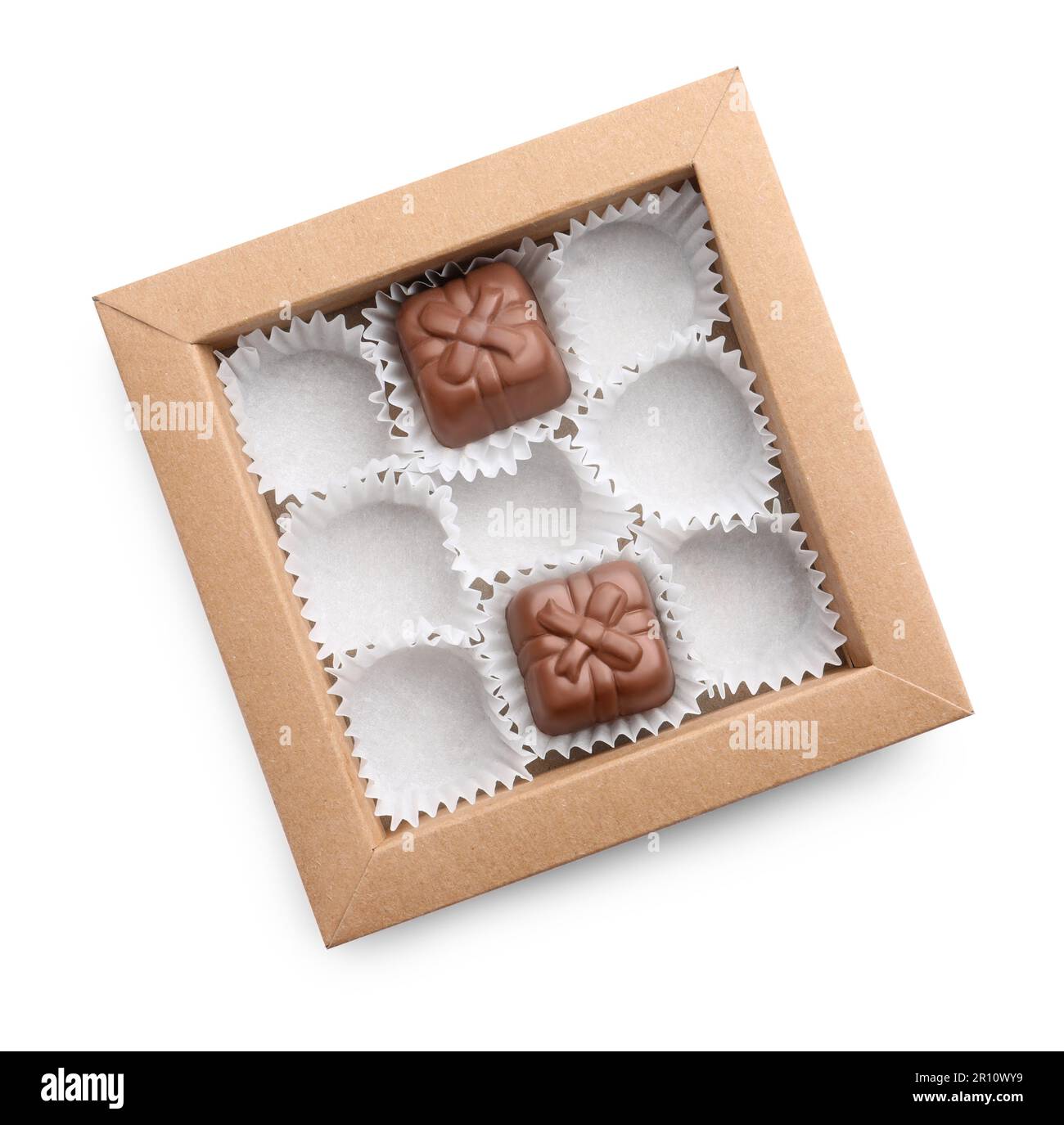 Partially empty box of chocolate candies isolated on white, top view ...