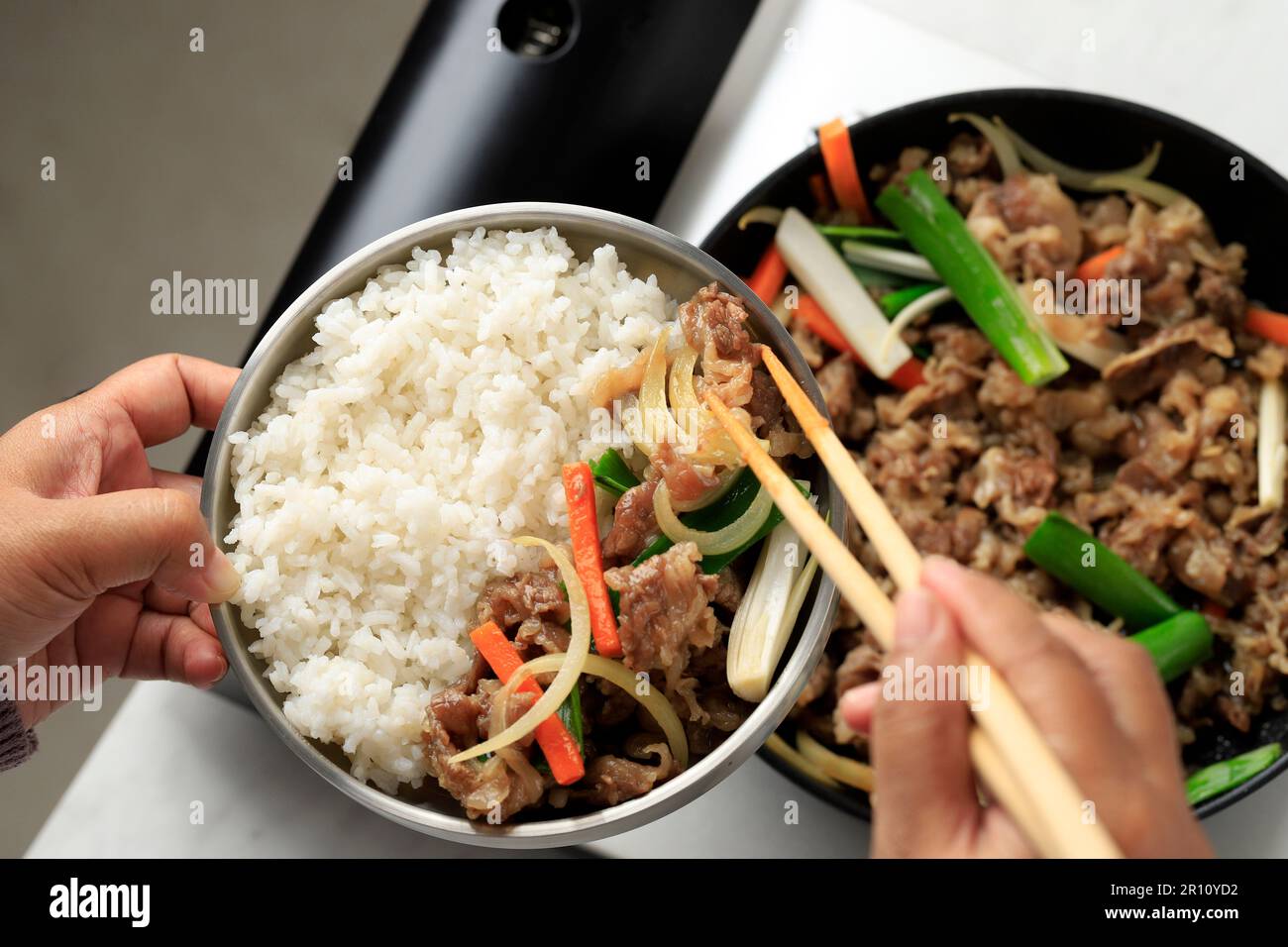 Plating Fresh Cooked Korean Beef Bulgogi witth Vegetable on a Plate of ...
