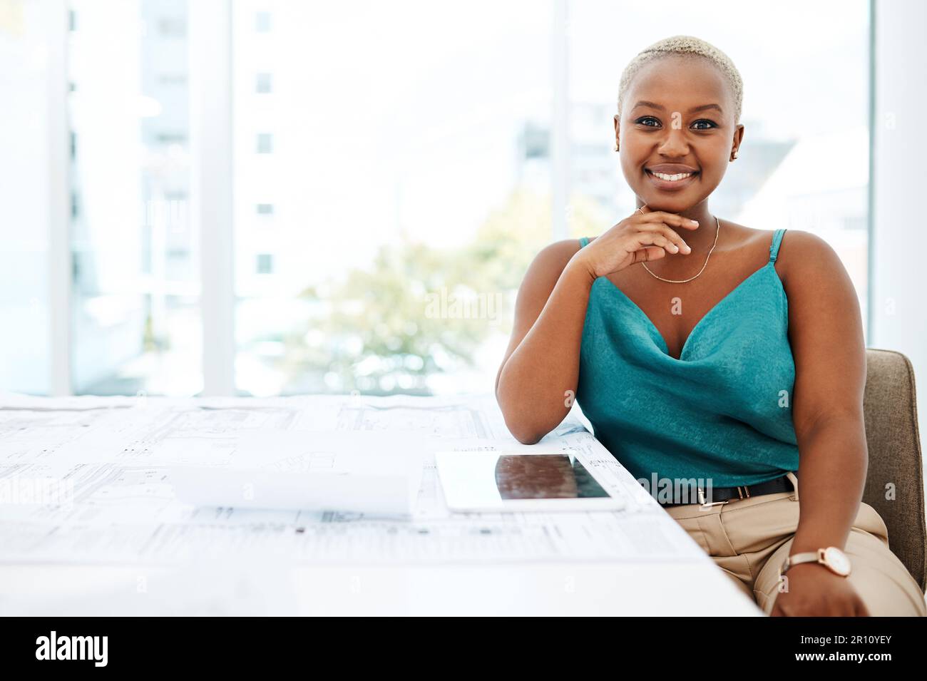 Creating satisfied clients is my specialty. Portrait of a young woman ...