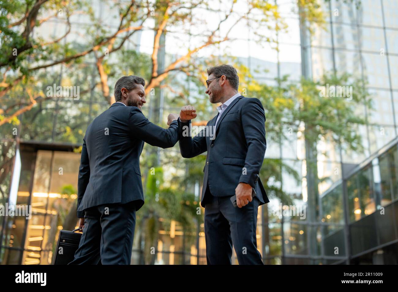 Business partners shaking hands. Handshake between two business men ...