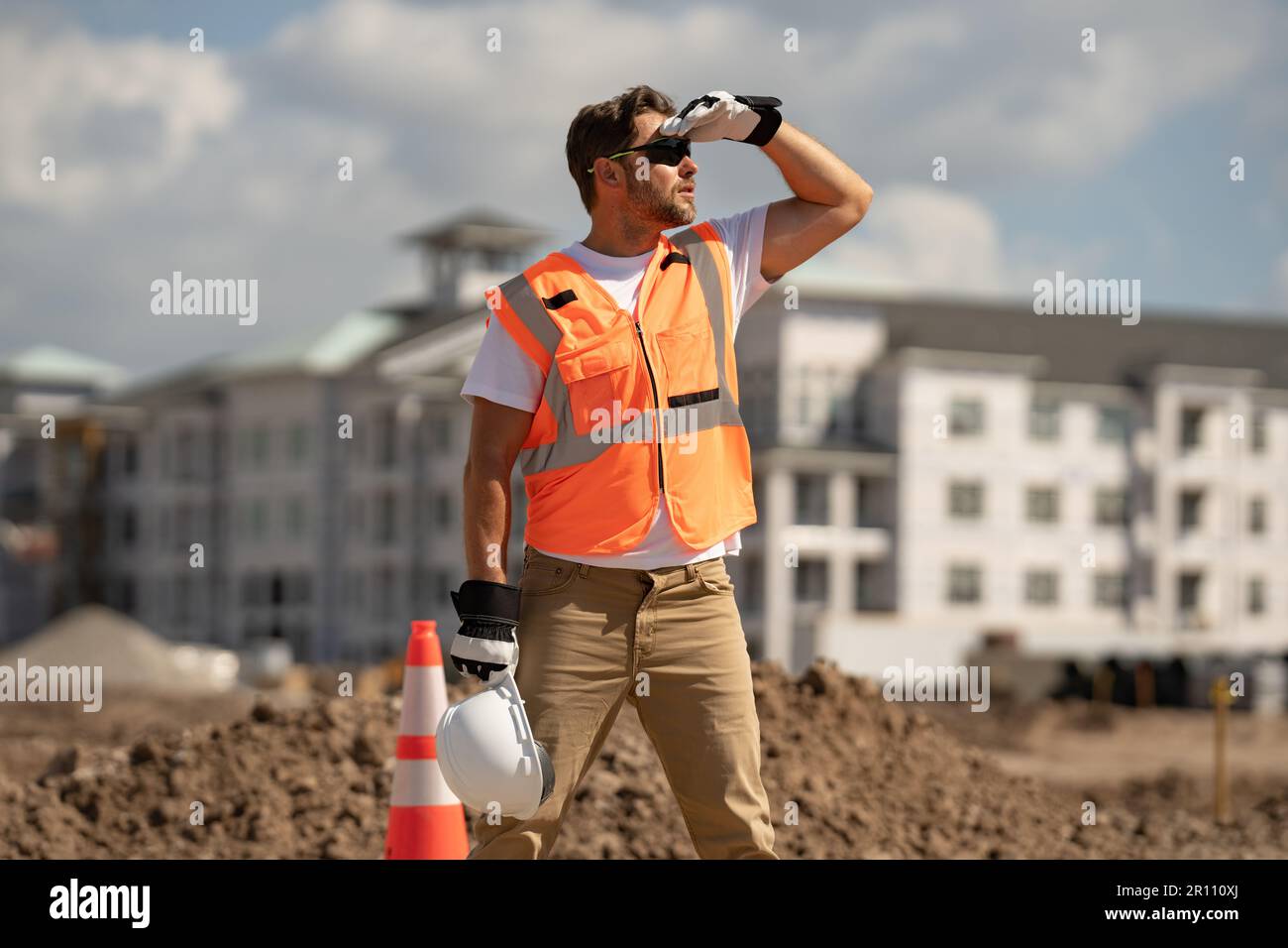 Construction man with helmet. Worker at construction new building ...