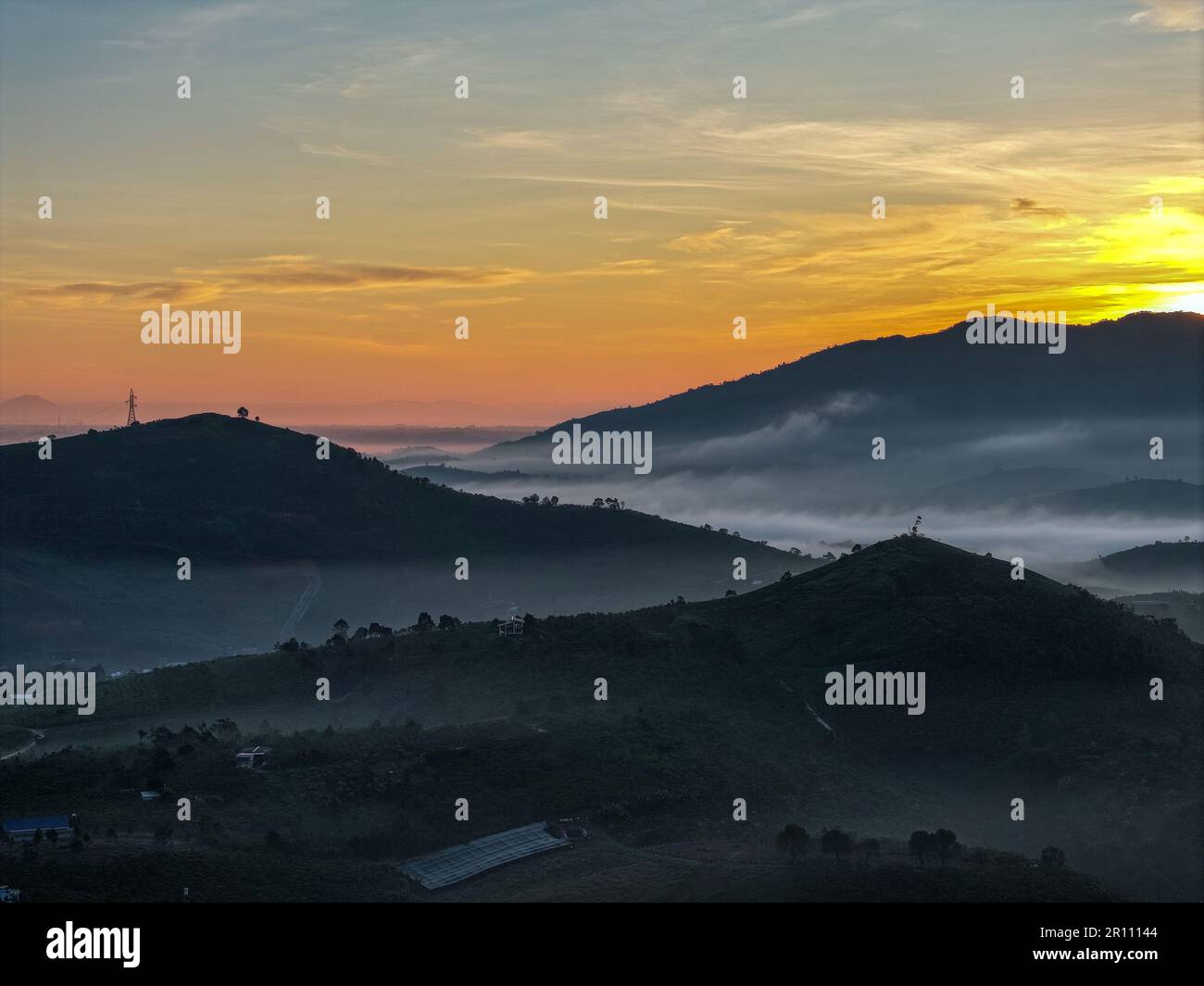 Magical view of Da Lat city, Vietnam. The pine forests are shrouded in ...