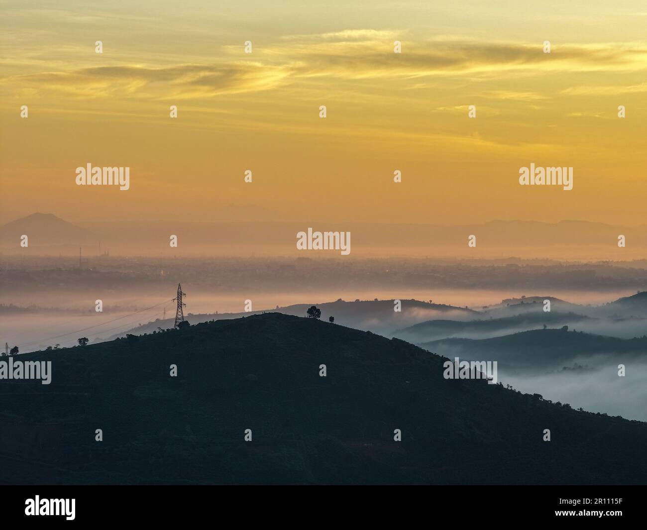 Magical view of Da Lat city, Vietnam. The pine forests are shrouded in ...