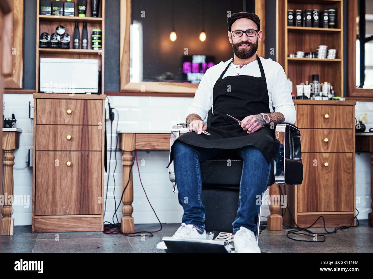 Cutting hair is my type of art. Full length shot of a handsome young ...