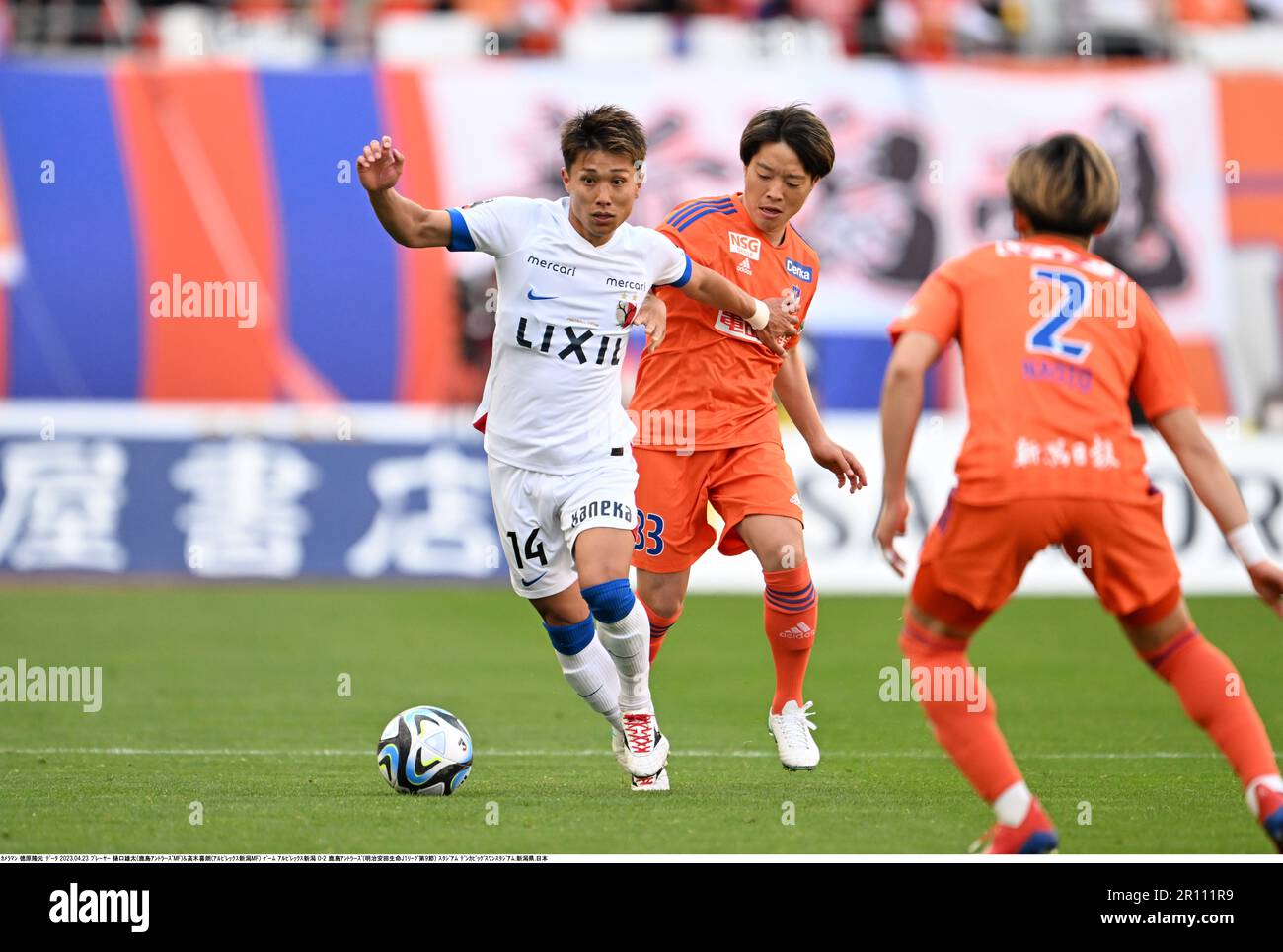 Kashima Antlers' Yuta Higuchi, left, and Albirex Niigata's Yoshiaki Takagi during the 2023 J1 ...