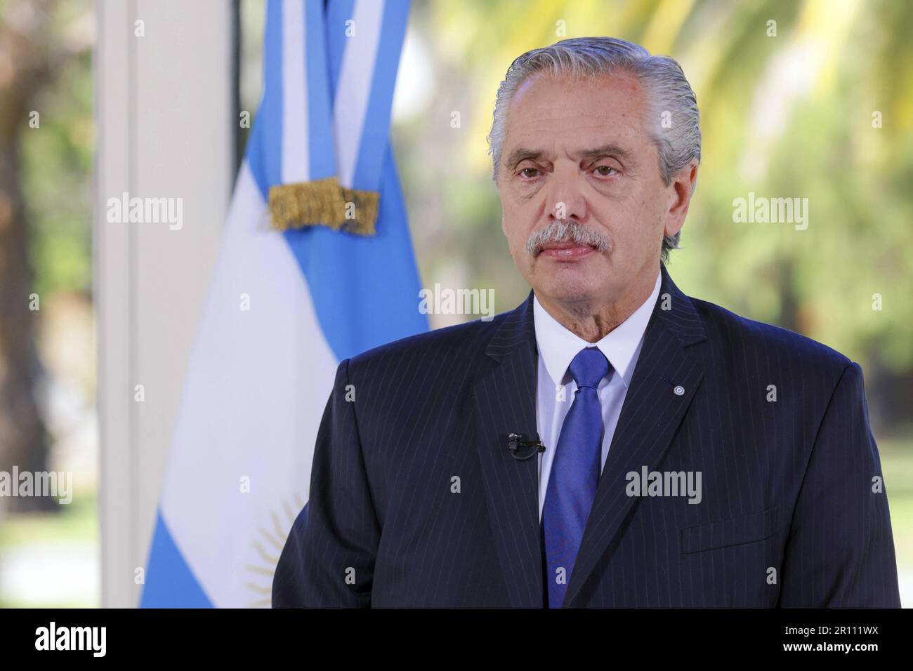Alberto Fernández and the flag of Argentina Stock Photo - Alamy