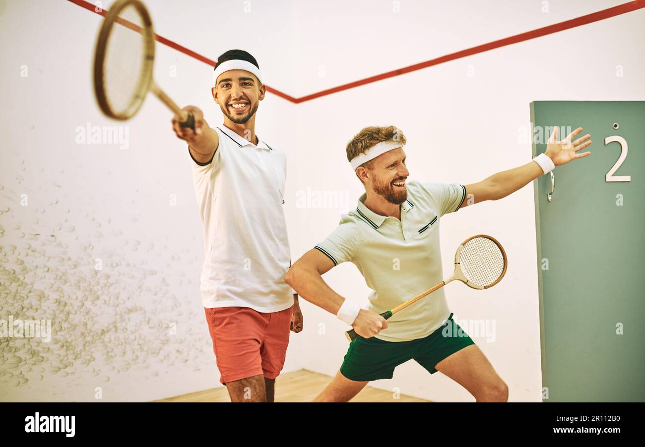 The wait is over, the winners are here. two young men playing a game of ...