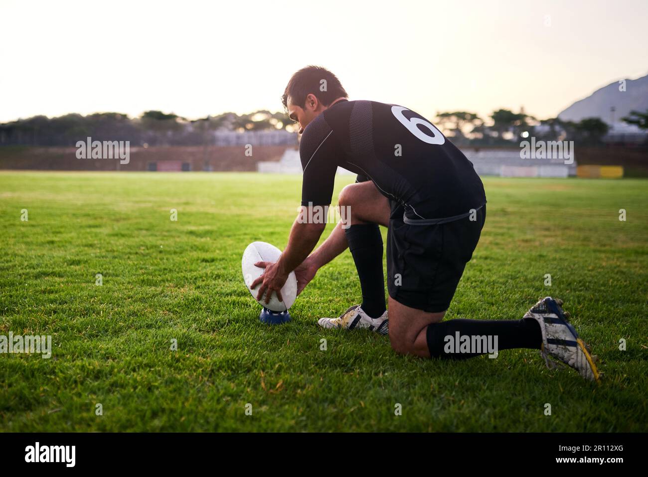 Lining it up perfectly. Full length shot of a handsome young sportsman ...