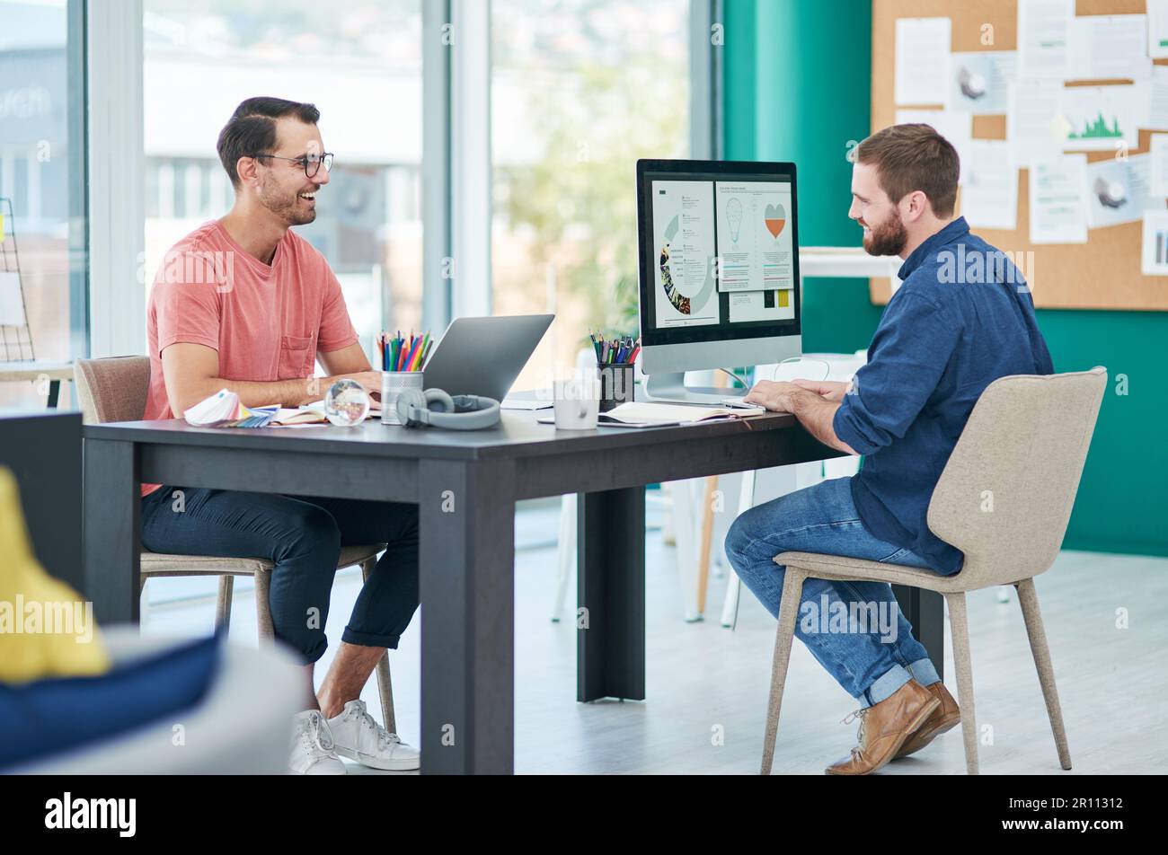 Far from the days of uncomfortable office cubicles. two young ...