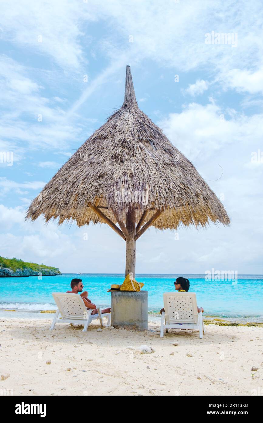 A couple of men and women on vacation in Curacao, Cas Abao Beach Playa ...