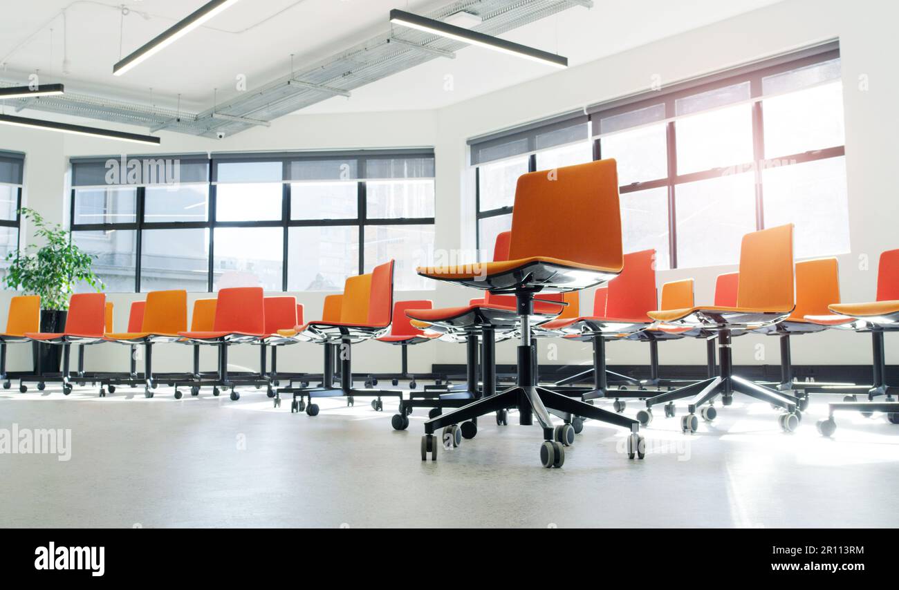 Take a seat, business is about to begin. chairs in an an empty modern ...