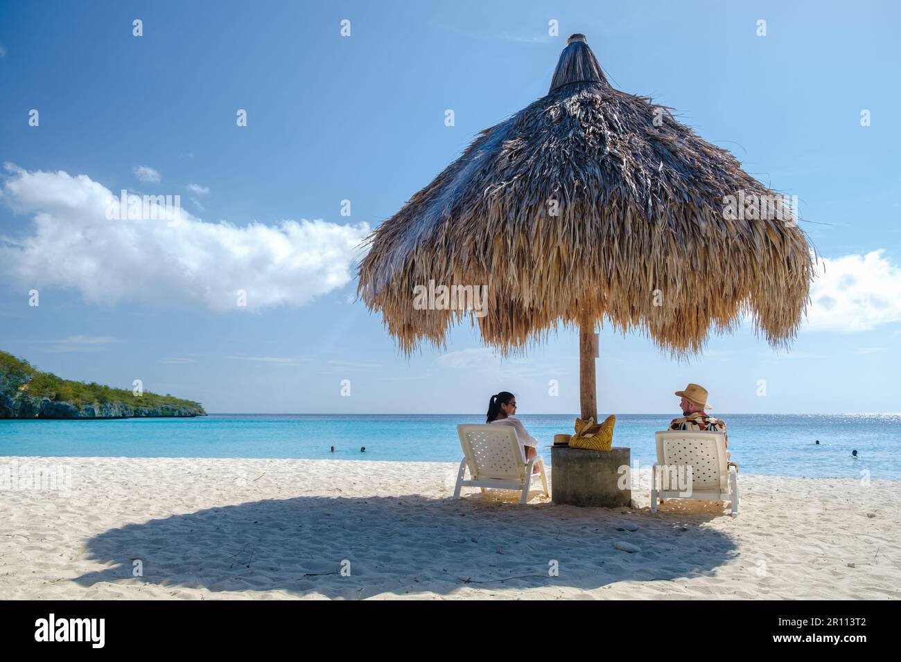 A couple of men and women on vacation in Curacao, Cas Abao Beach Playa ...
