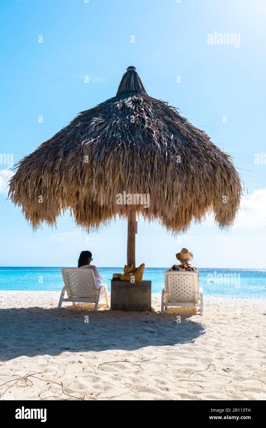 A couple of men and women on vacation in Curacao, Cas Abao Beach Playa ...
