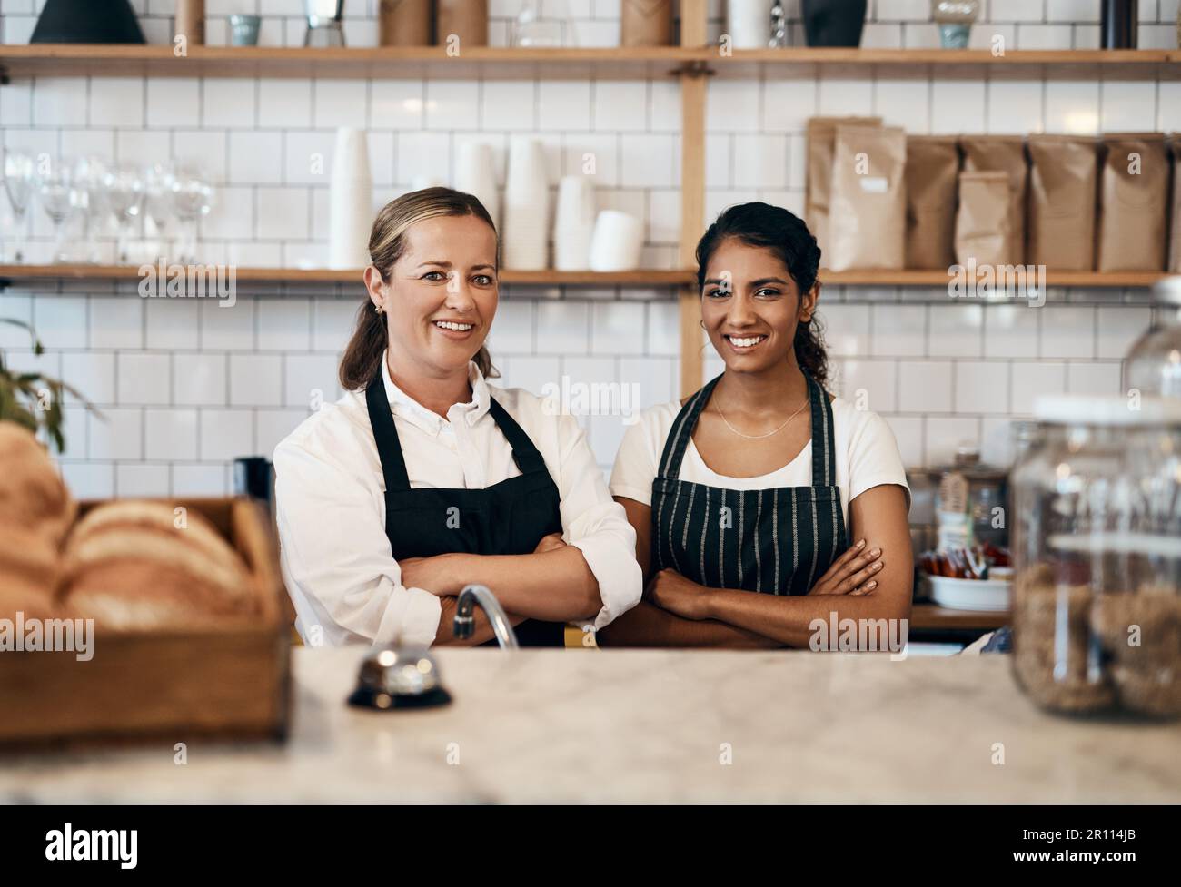 It takes a great team to run a great bakery. Portrait of two confident ...