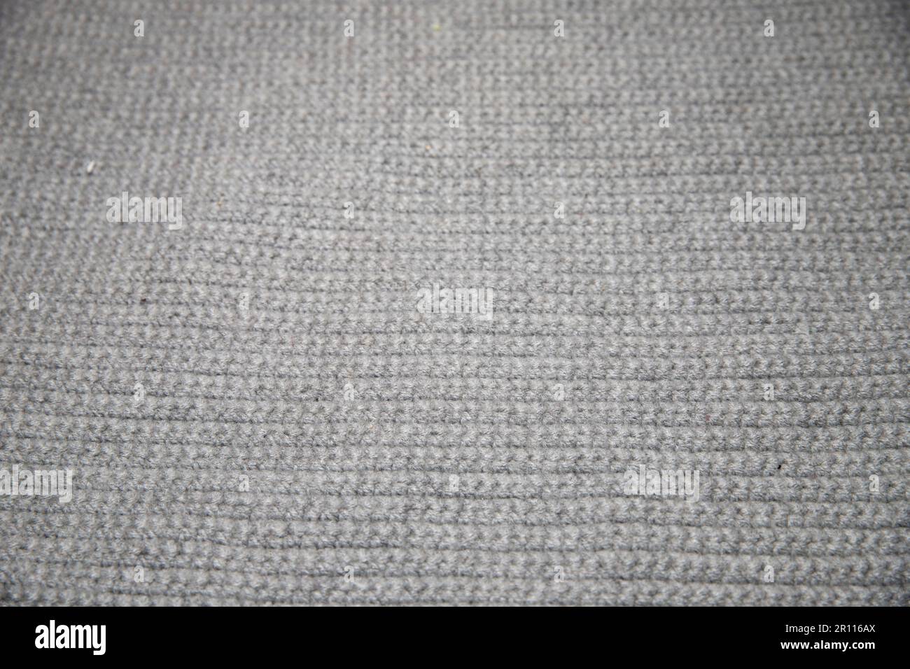 close up of gray knitted or crocheted tight knit blanket , This modern ...