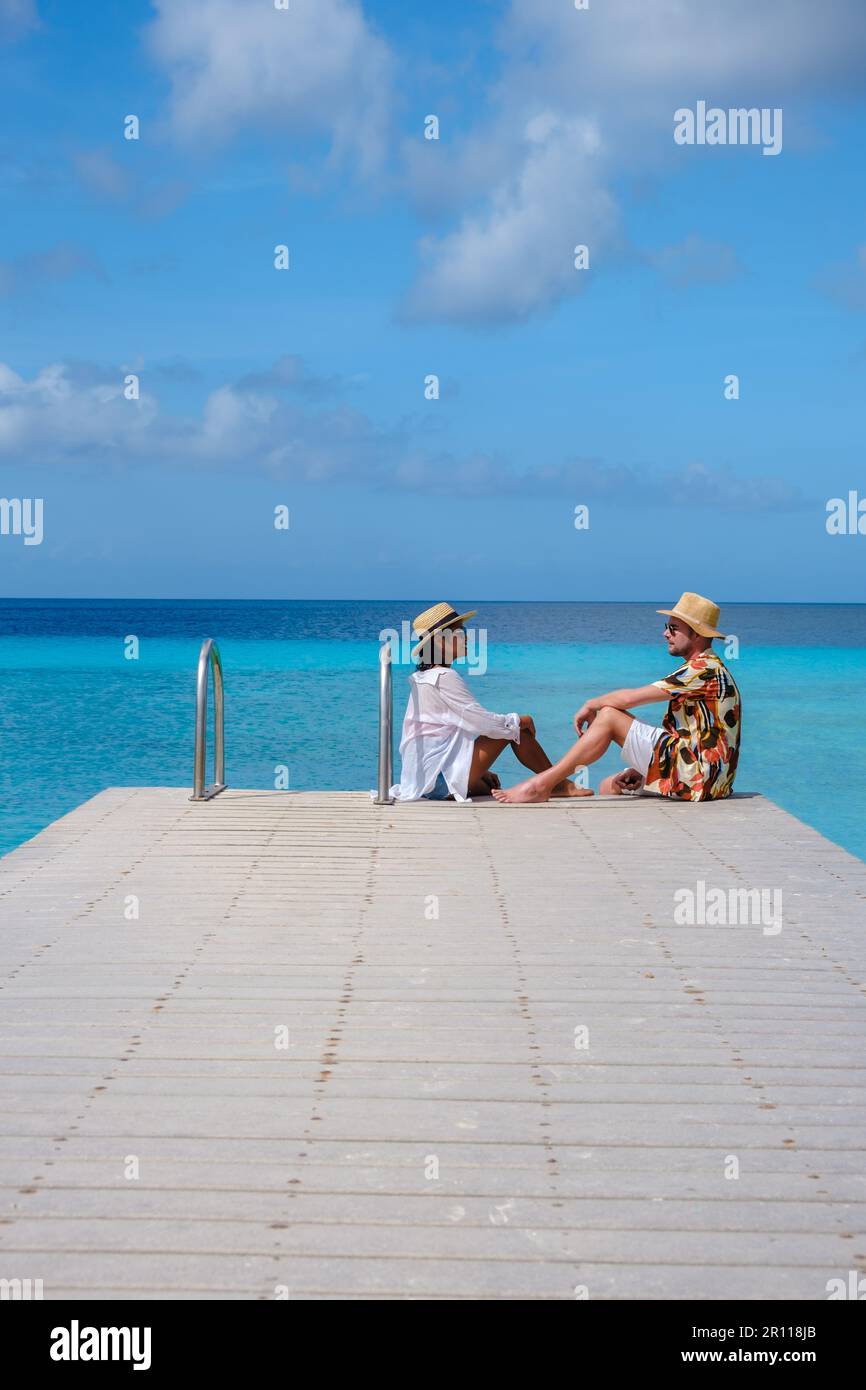 Playa Porto Marie Beach in Curacao, a Couple of men and woman on a ...