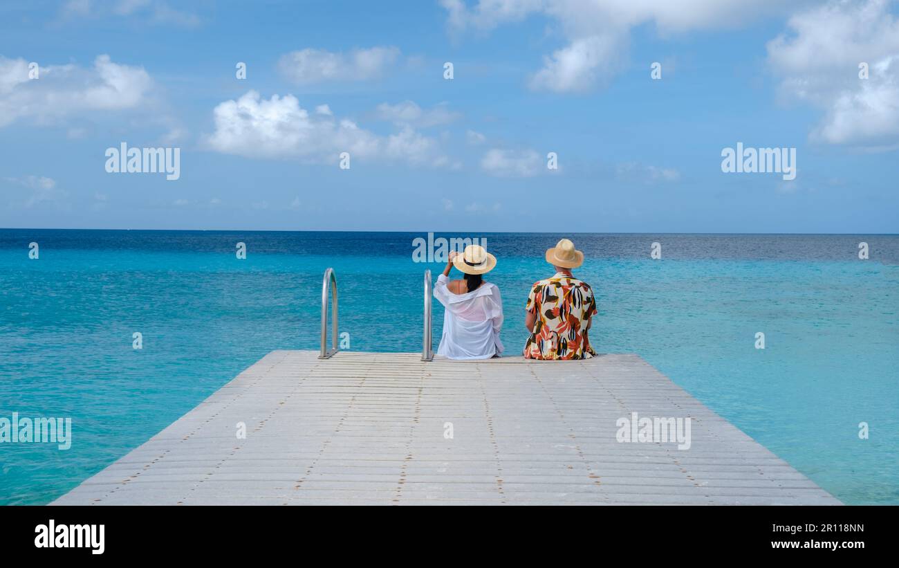Playa Porto Marie Beach in Curacao, a Couple of men and woman on a ...
