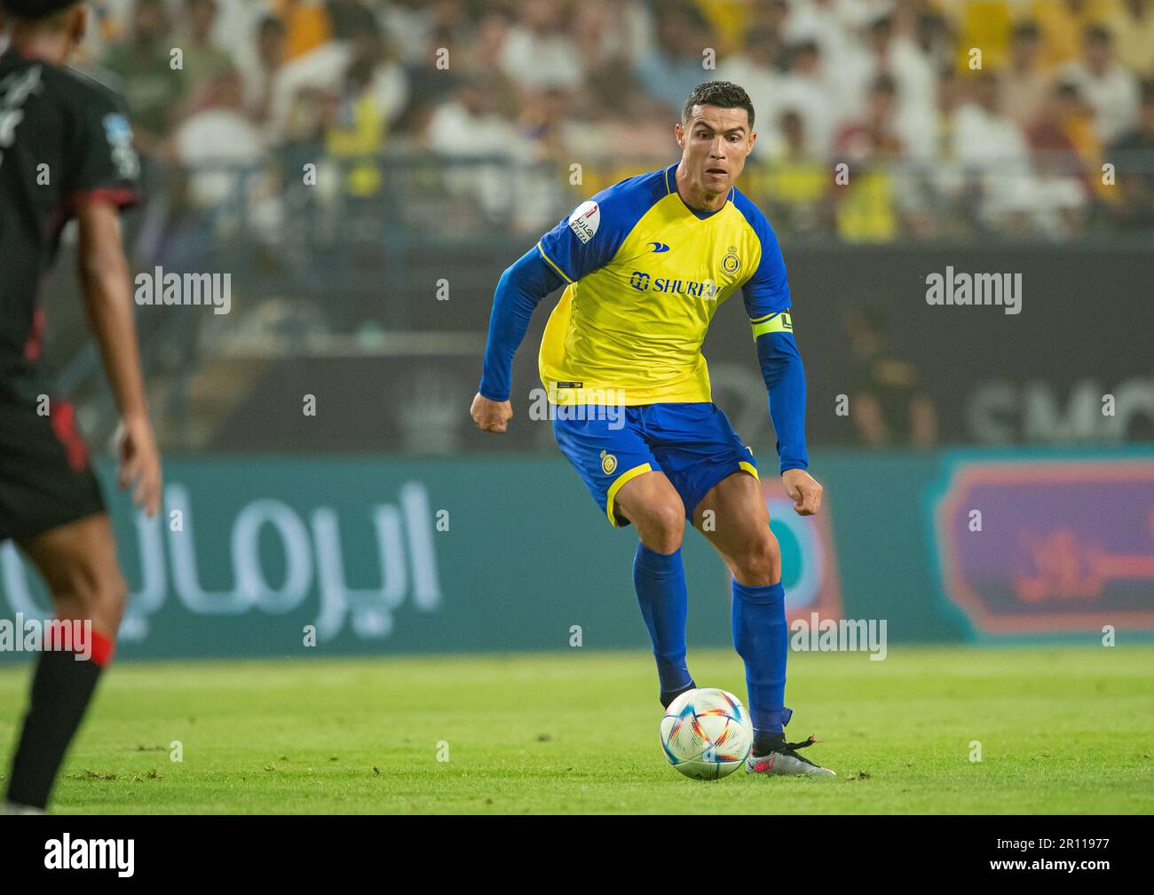 Cristiano Ronaldo of Al-Nassr FC in action against Al-Raed FC during ...