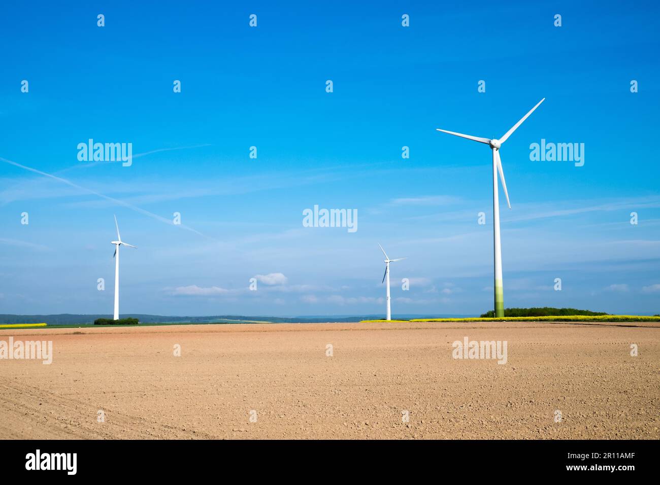 Wind turbines behind field hi-res stock photography and images - Alamy