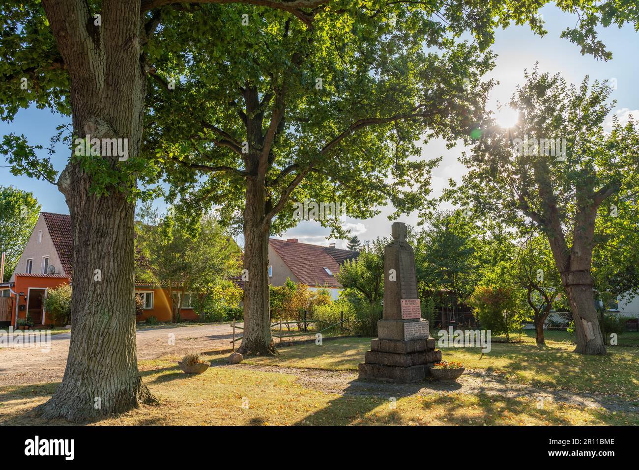 Village square with war memorial for the fallen of the world wars ...