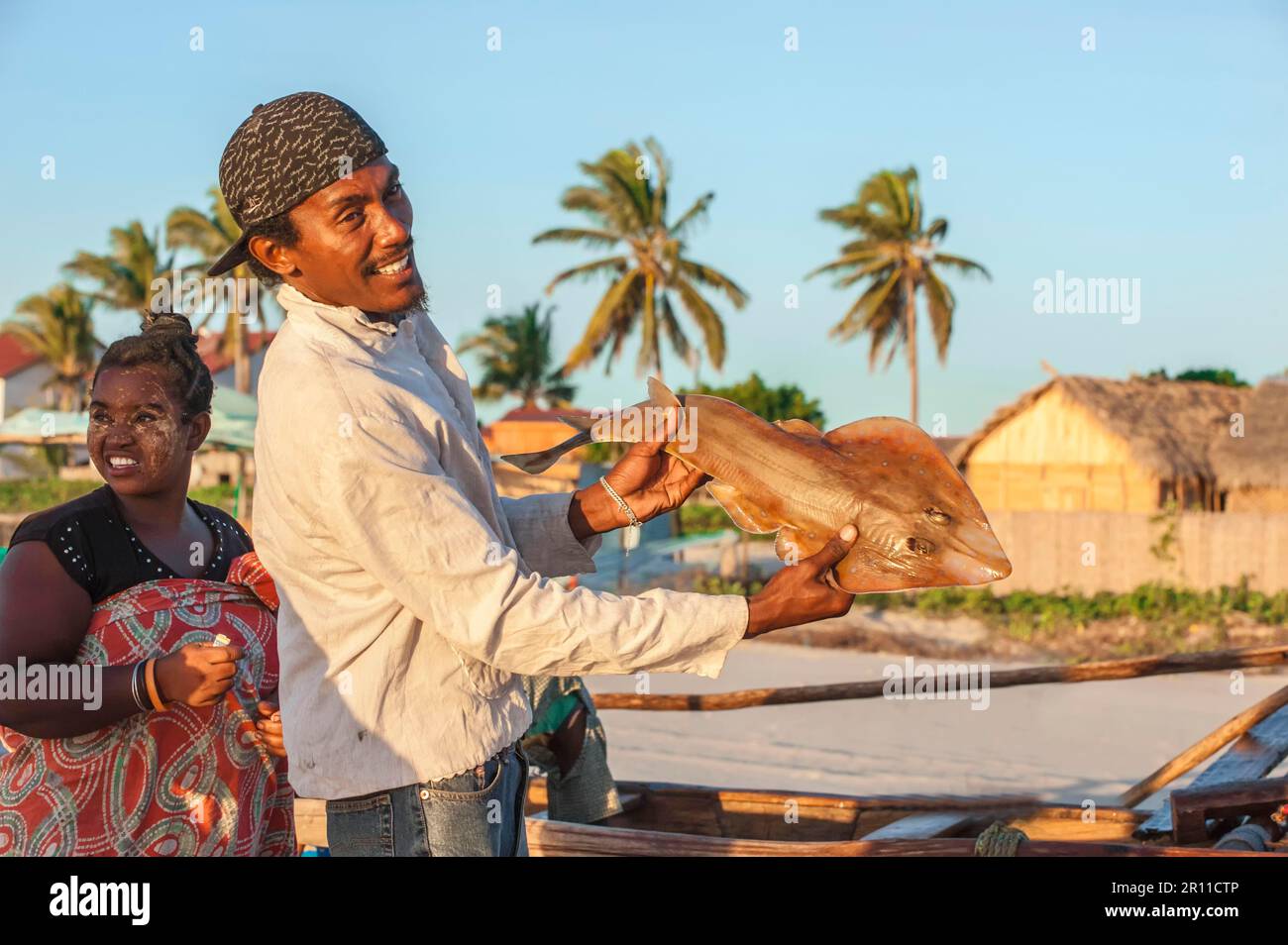 Malagasy fisherman showing his catch, Morondava, Toliara Province ...