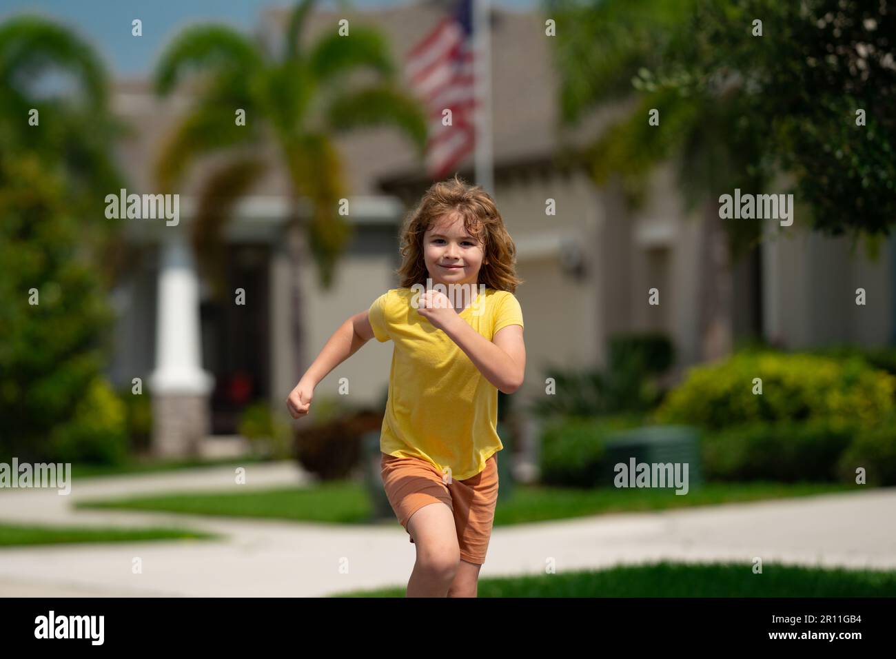 Child running in summer street. Kid enjoy run. Kid running on ...