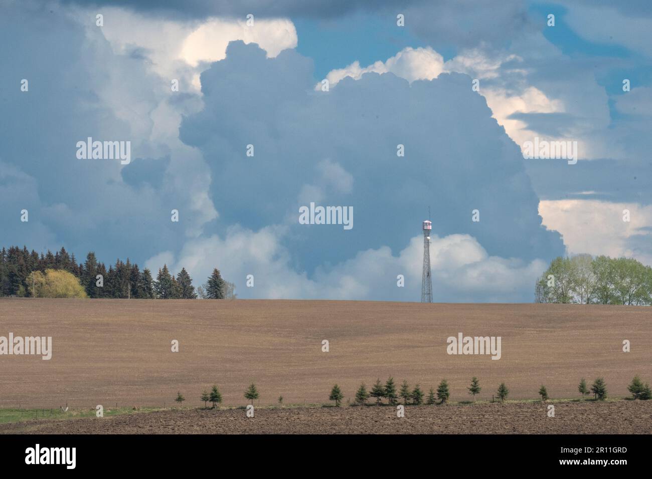 Thunder clouds build behind an Alberta forest fire lookout tower Stock ...