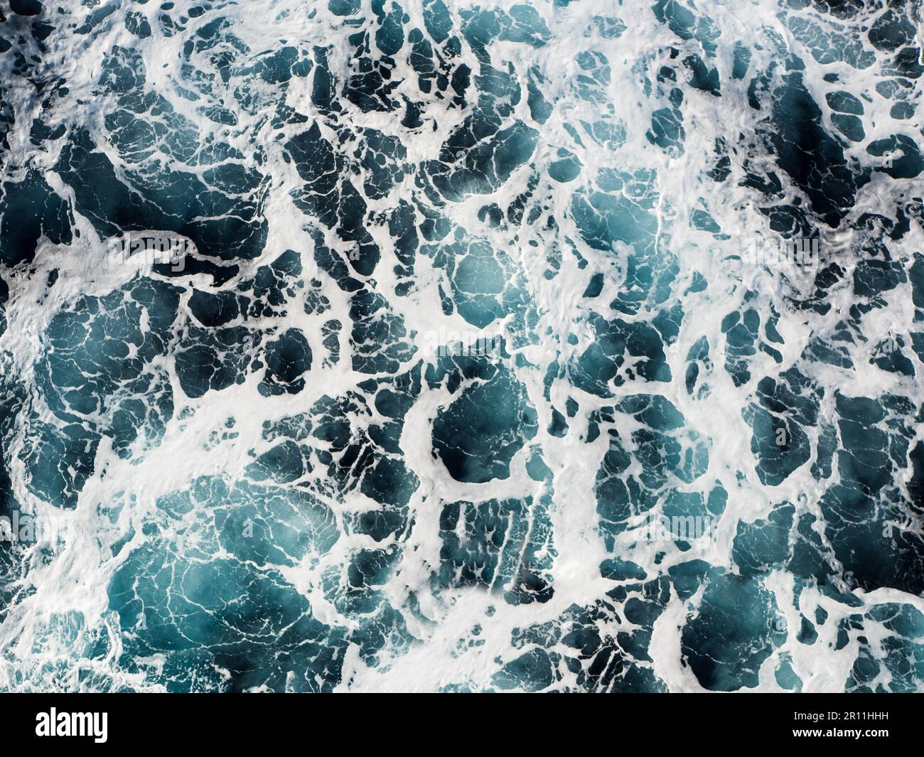 Rough dark ocean and white water surface background Stock Photo - Alamy