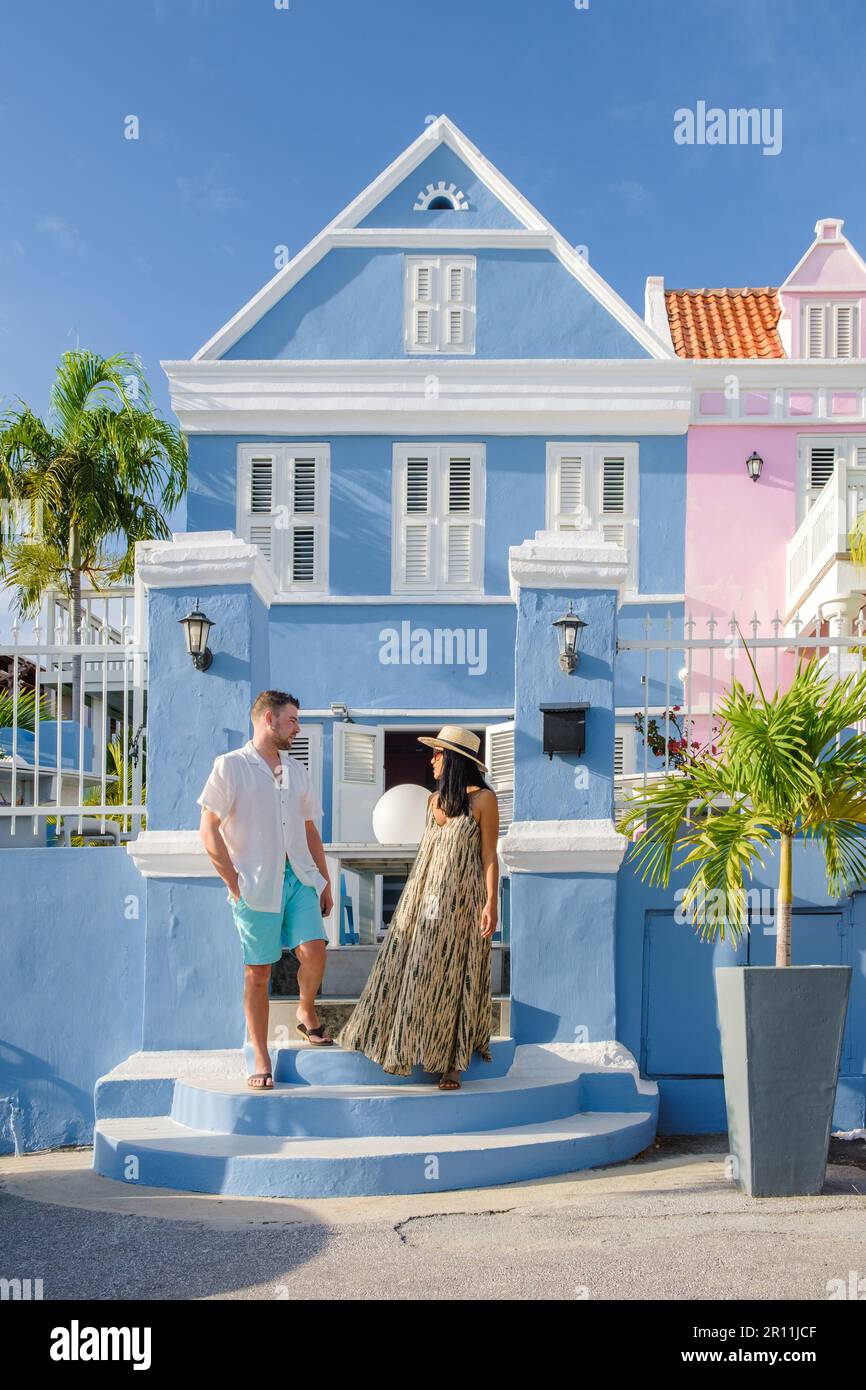 couple men and woman on vacation in Curacao visiting Pietermaai Street ...