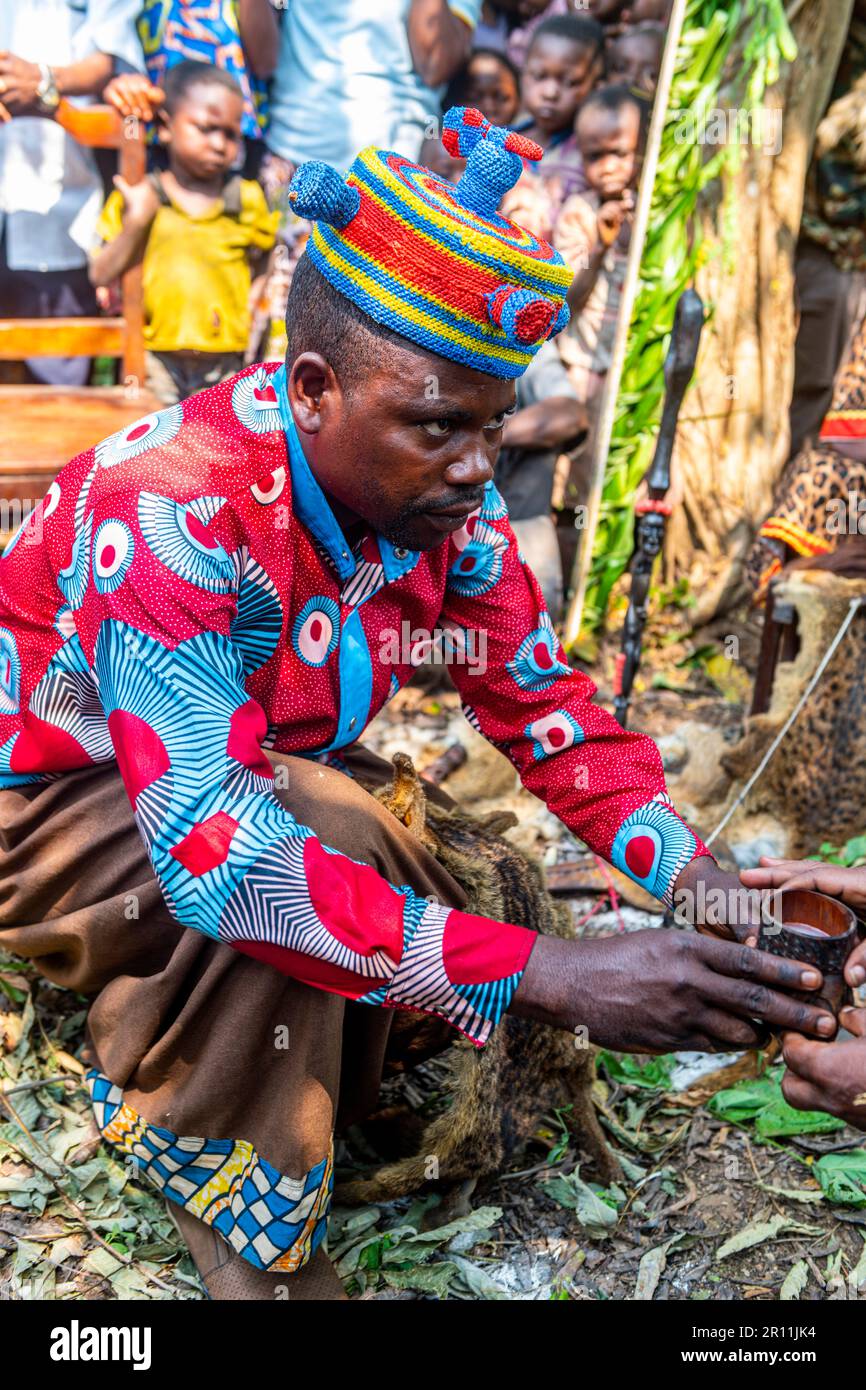 Tribal man drinking local wine, Yaka tribe, Mbandane, Congo Stock Photo ...