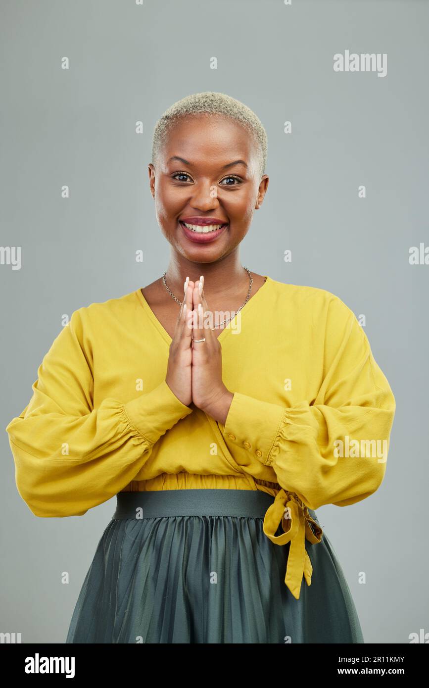 Gratitude, praying hands and portrait of happy woman in studio with ...