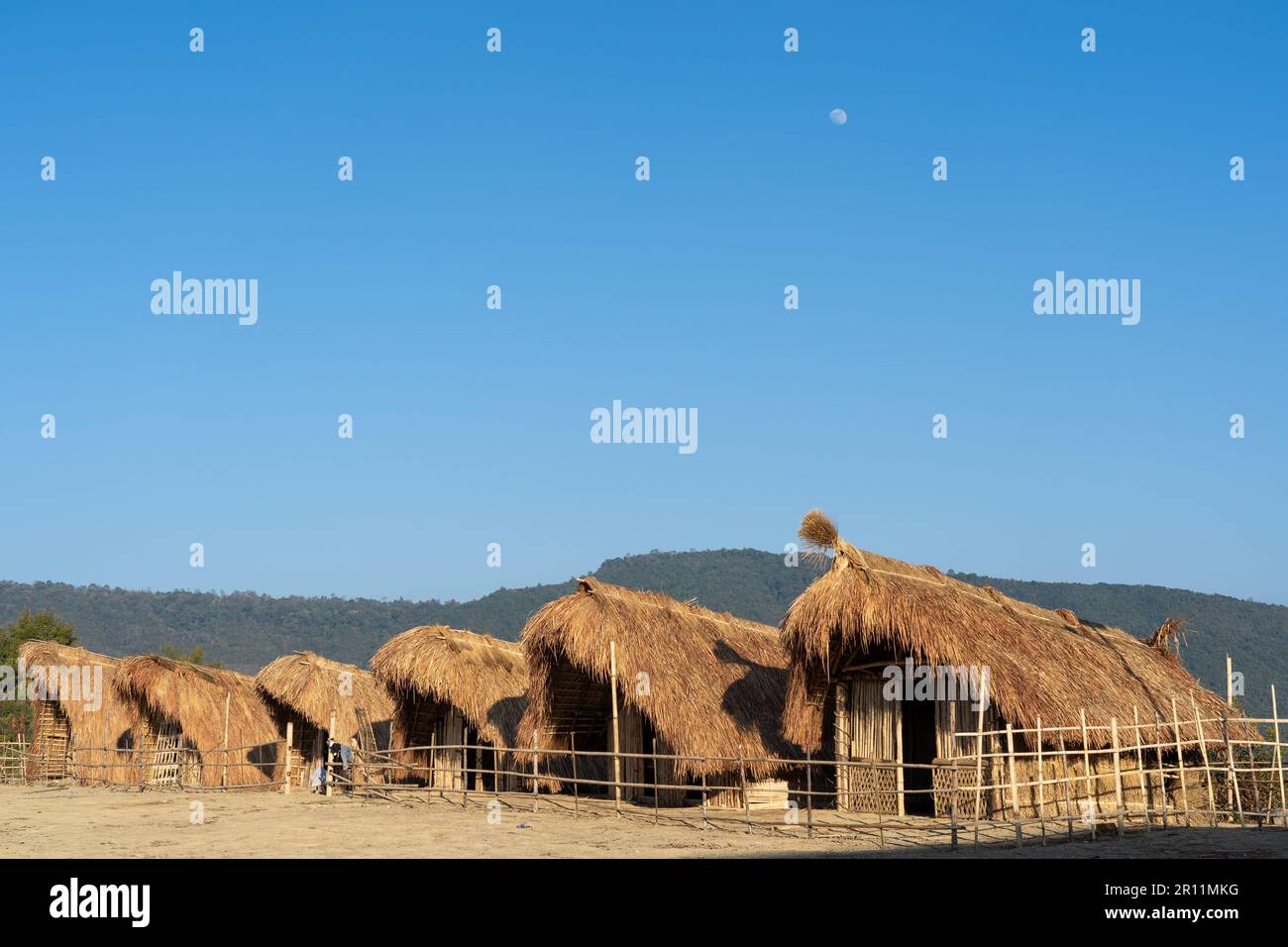 The picturesque straw huts in the dramatic mountainous landscape Stock ...