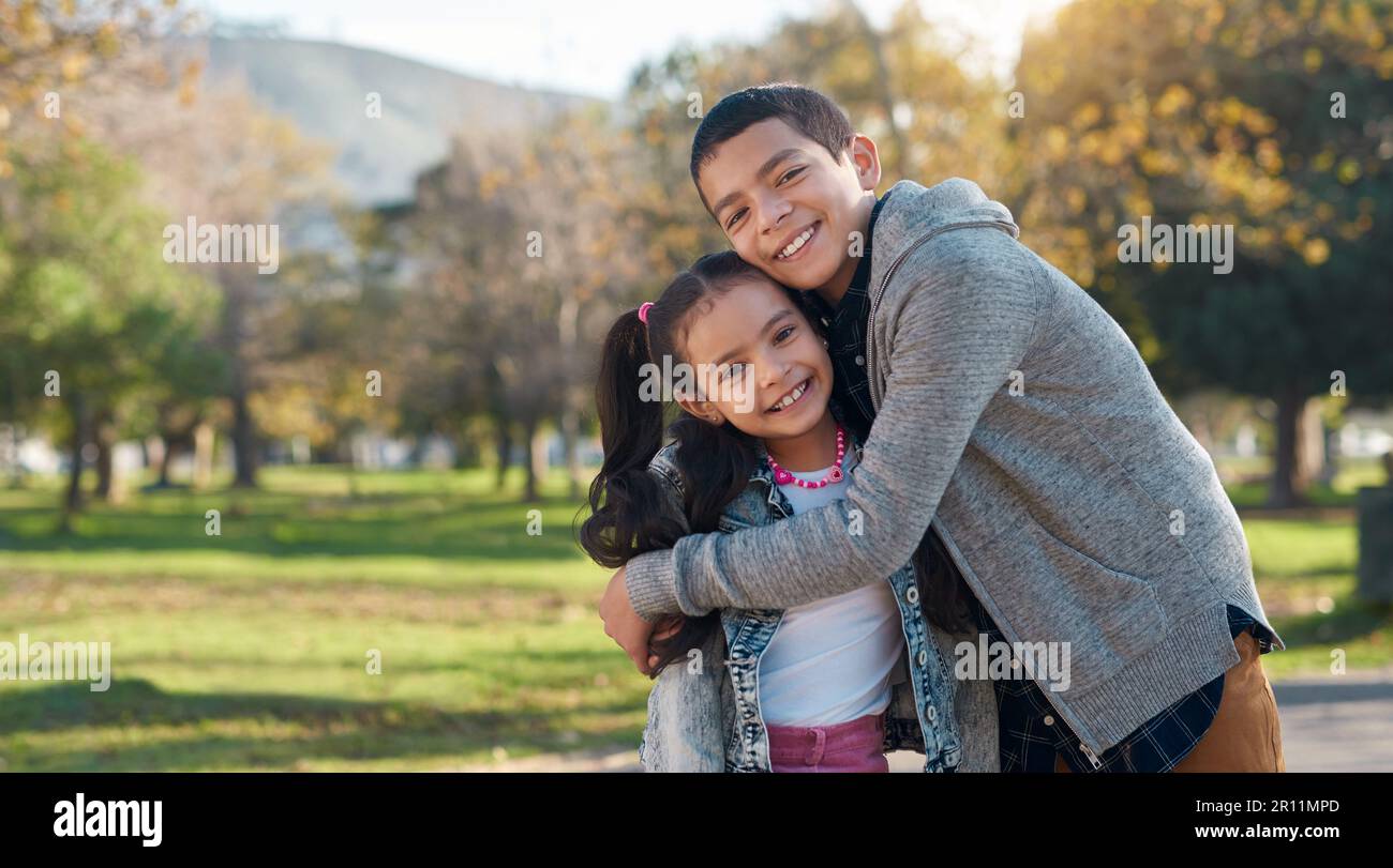 Park, hug and portrait of brother and sister enjoying summer day for ...