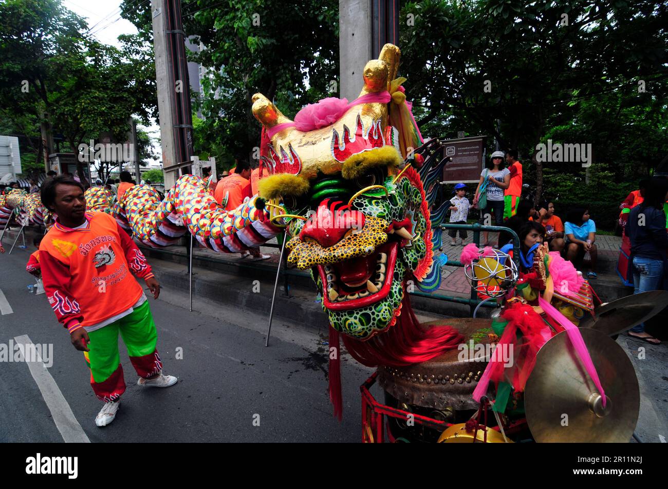 A colorful parade along Charoen Nakhon Rd in Bangkok, Thailand Stock ...