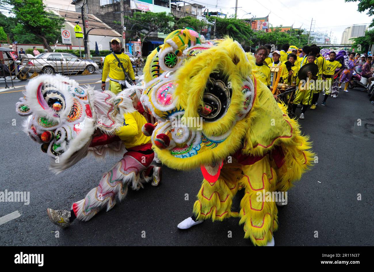 A colorful parade along Charoen Nakhon Rd in Bangkok, Thailand Stock ...