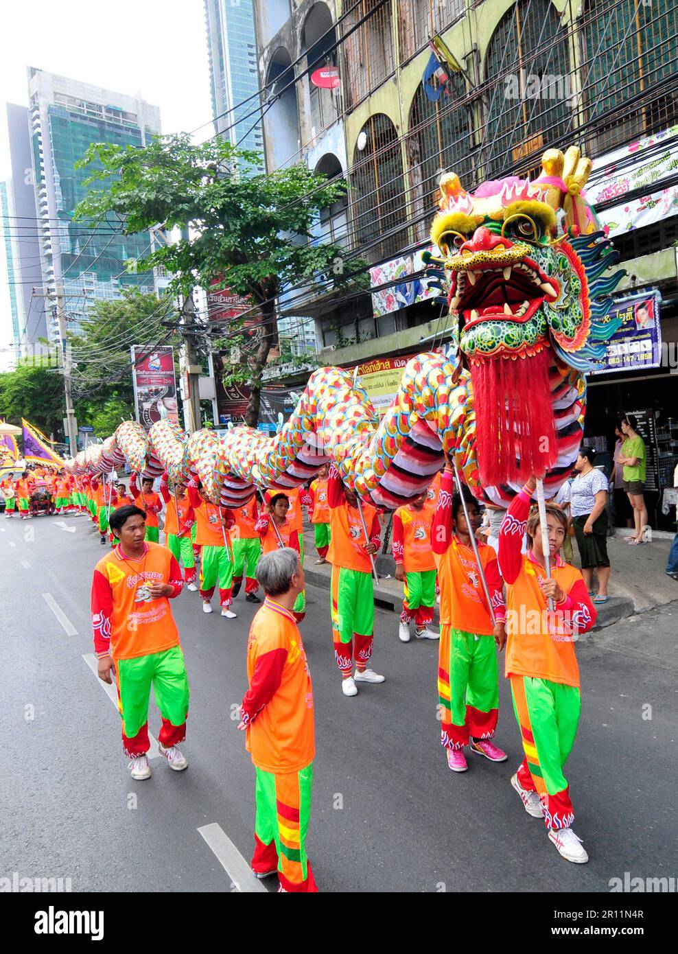 A colorful parade along Charoen Nakhon Rd in Bangkok, Thailand Stock ...