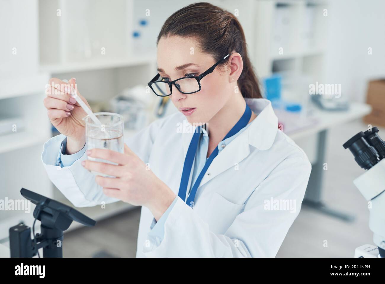 Looks like were getting somewhere. a focused young female scientist ...