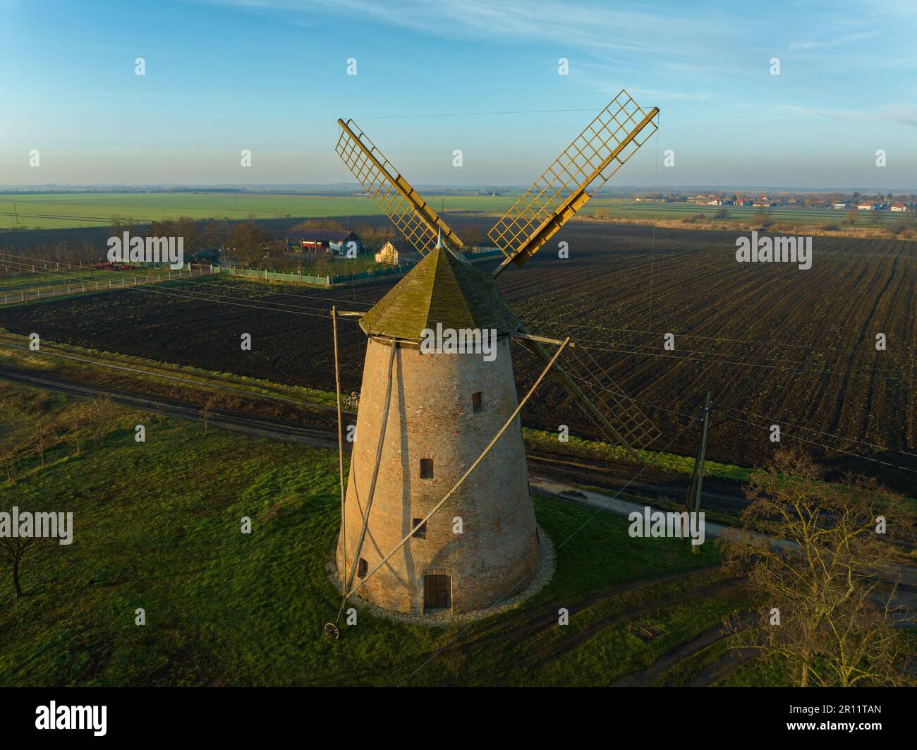 Kunhegyes Windmill, located in Hungary, This traditional wooden windmill stands tall in the ...