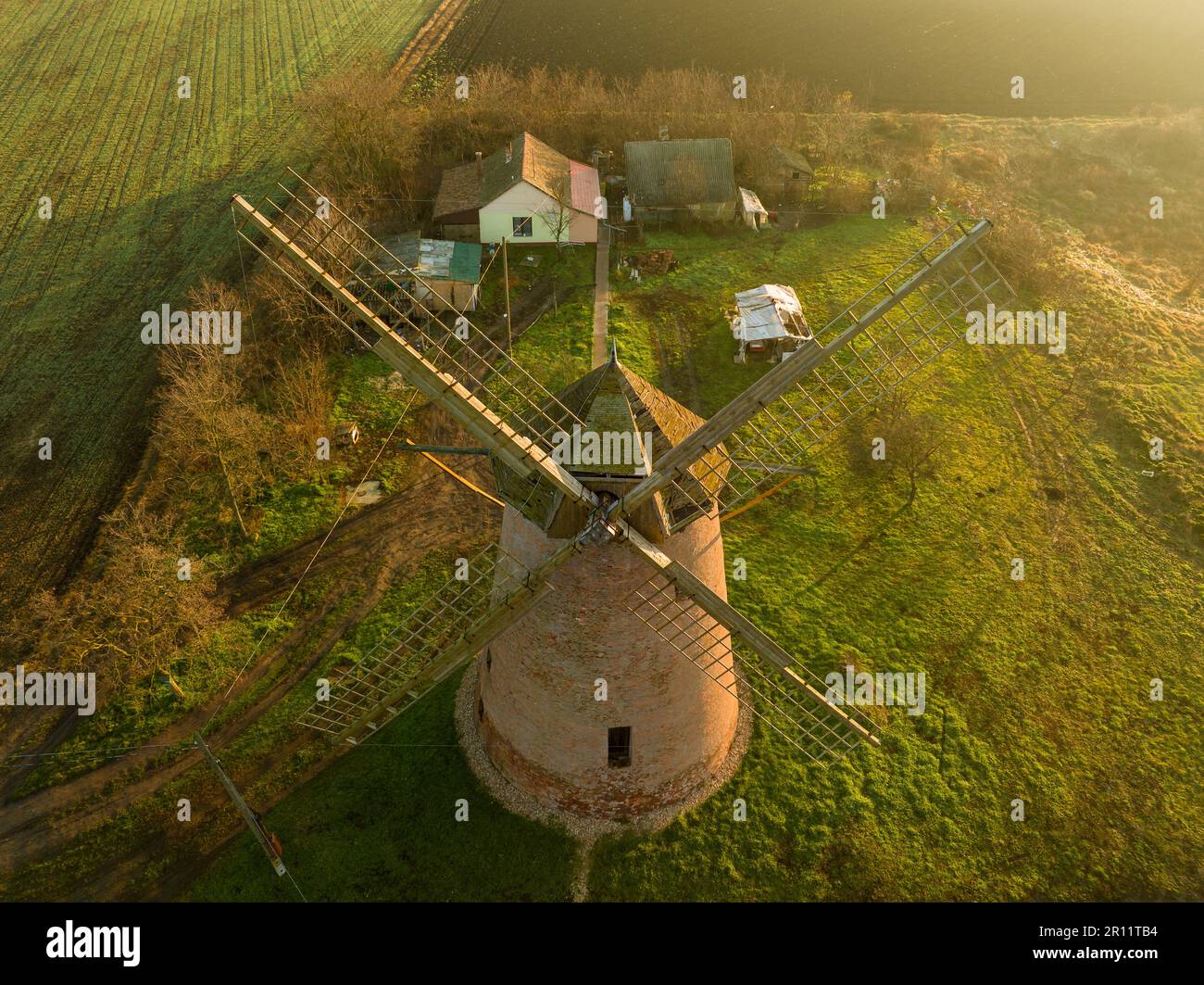 Kunhegyes Windmill, located in Hungary, This traditional wooden windmill stands tall in the ...