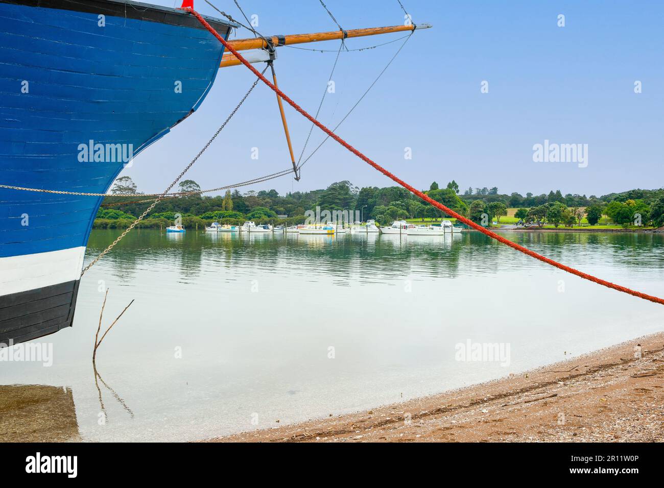 Square rig ship bow framing scene across bay Stock Photo - Alamy